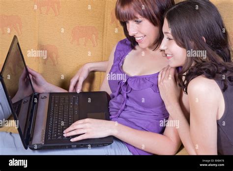 Girls Using Laptop At Home Stock Photo Alamy