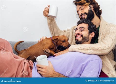 Happy Couple Of Gay Men Relaxing On The Sofa Stock Image Image Of