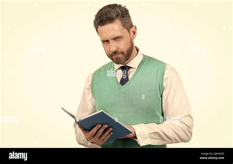 Serious Guy Reading Planner Isolated On White Background Planning