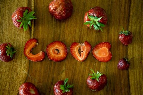Love Sign Made From Strawberry Pieces On A Table Whote Strawberries Around Stock Image Image