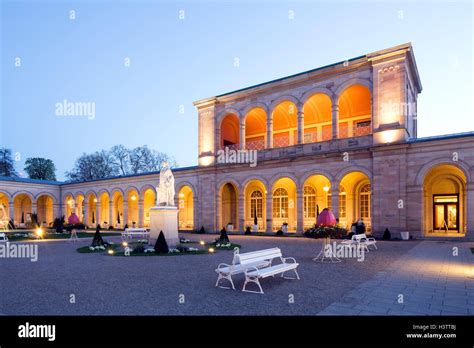 Lighted Arcade Building At Dusk With Rossini Hall And Arcade Passage