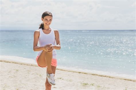 Premium Photo Portrait Of Happy Sporty Woman Doing Legs Stretching