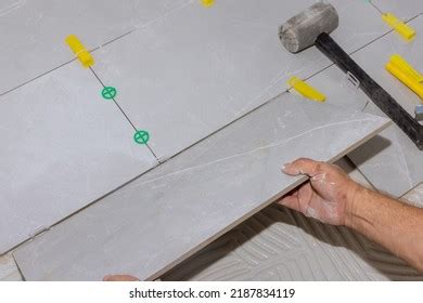 Placing Ceramic Floor Tiles On Adhesive Stock Photo 2187834119 Shutterstock