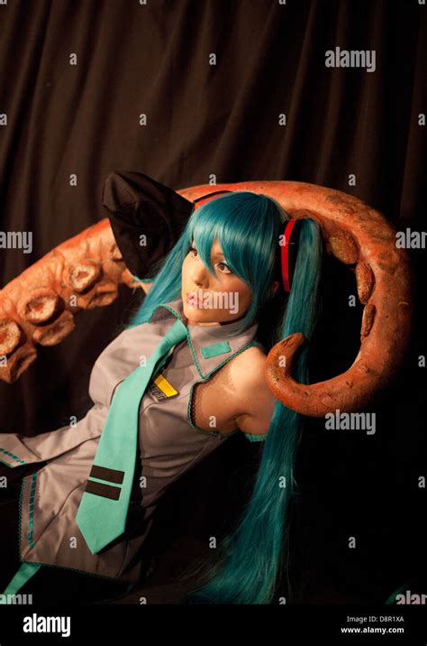Cosplay Anime Performer Poses Onstage With A Big Fake Octopus Tentacle