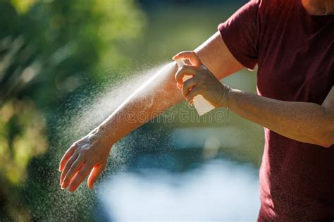 Woman Applying Insect Repellent On Her Arm Outdoors Stock Photo Image Of Chemical Closeup