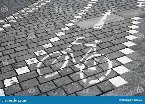 Two Lane Road With A Pedestrian And Cycle Path Next To It Separated By