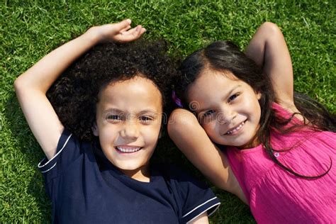 I Love My Sister A Smiling Brother And Sister Lying On The Grass