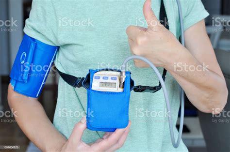 Woman Wearing Holter Monitor Device For Daily Monitoring Of An