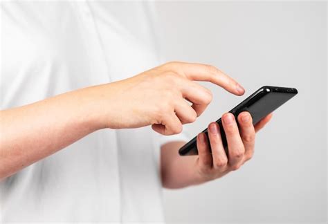 premium photo woman hand clicking or swiping phone screen female