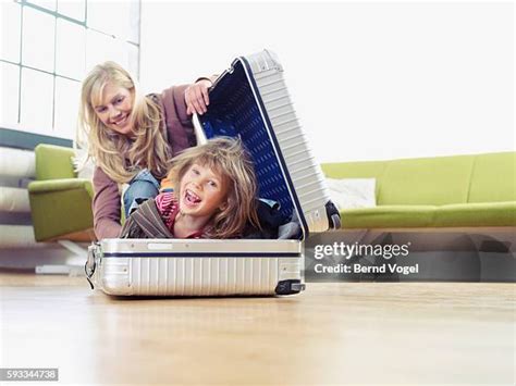 Person Hiding In Suitcase Photos And Premium High Res Pictures Getty