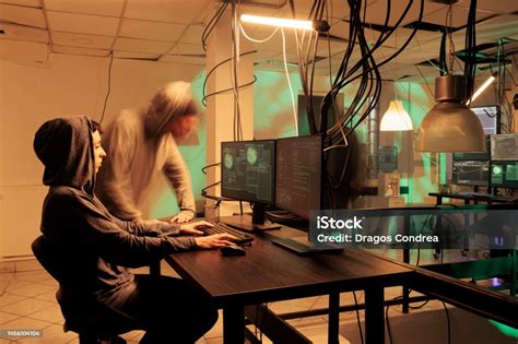hacker breaking into internet network system coding computer worm stock
