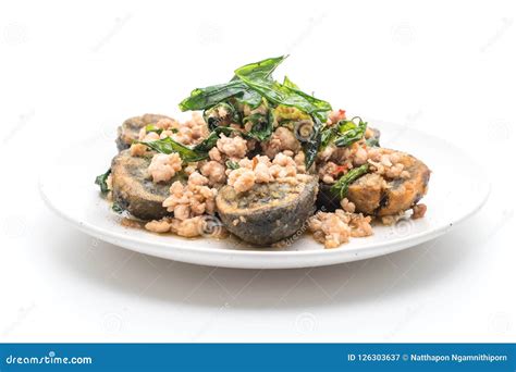 Stir Fried Century Egg And Minced Pork With Holy Basil Leaves Stock