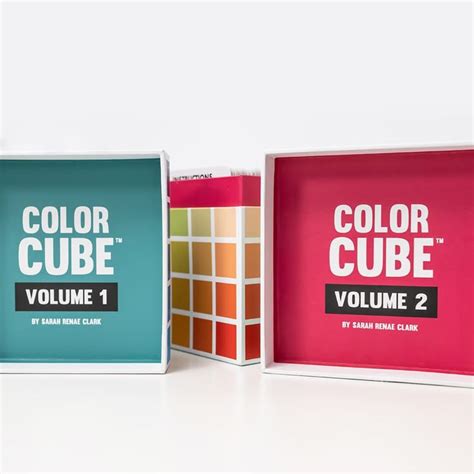 Three Different Color Cubes Sitting Next To Each Other