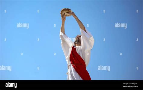 Jesus God Raising Bread In Hands To Sky Blessing Sacramental Food