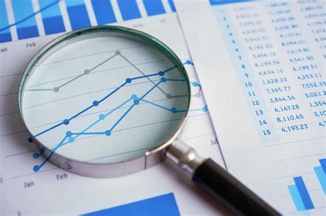 Premium Photo Magnifying Glass On Charts Graphs Paper Financial
