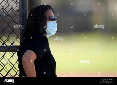 Miami Marlins General Manager Kim Ng Watches From A Distance During Spring Training Baseball
