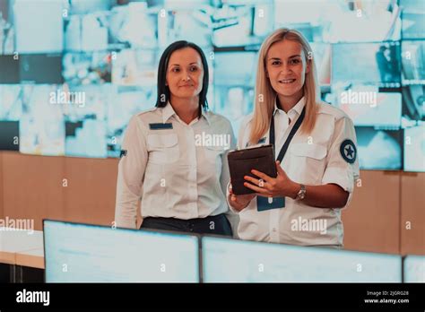 Group Portrait Of Female Security Operator While Working In A Data System Control Room Offices
