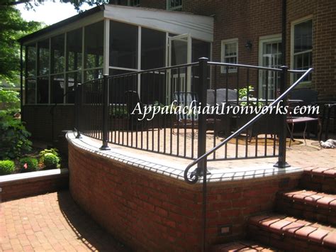 An Outdoor Patio With Steps And Railings