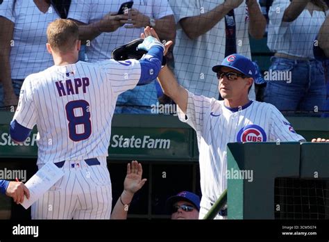 Chicago Cubs Ian Happ 8 Is Greeted By Manager Craig Counsell Right