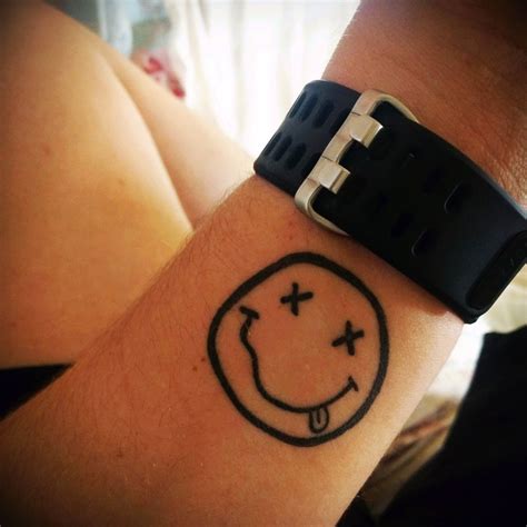 Nirvana Smiley Face Logo Tattoo