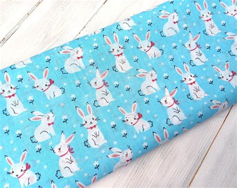 Bunny Polycotton Fabric Spring Rabbit Floral Print On Blue Easter
