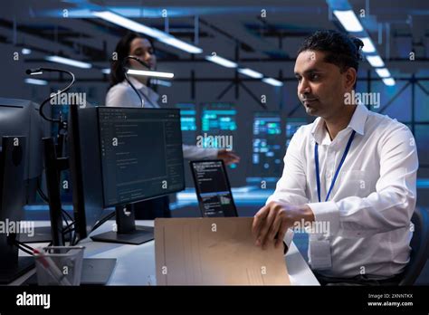 Data Center Professional Developing Emergency Procedures To Ensure Company Continuity In Case Of