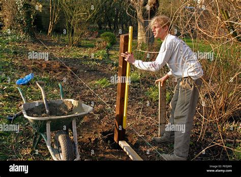 Man Building Fence Stock Photo Alamy