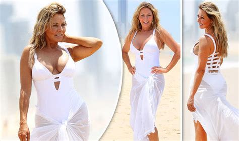 Carol Vorderman Flashes Sideboob And Sexy Curves In Plunging Swimsuit
