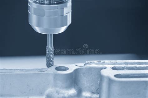 The Cnc Milling Machine Grinding The Casting Part By Chamfer Tool Stock