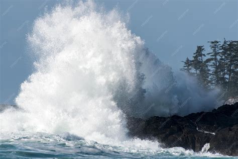 Premium Photo Wave Crashing On A Rocky Coastline In Big Beach