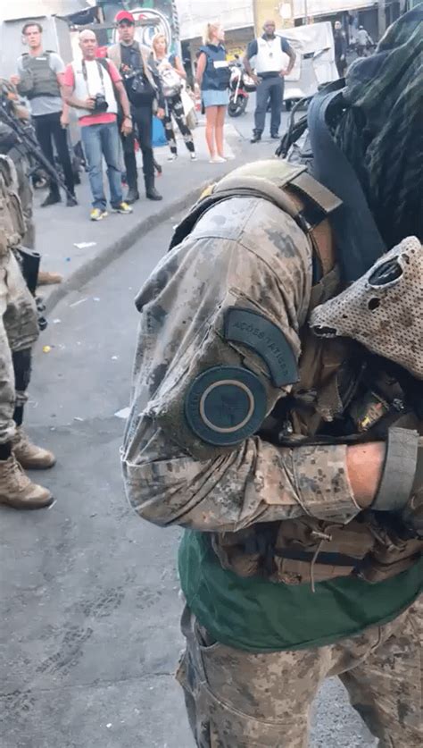 Rprotectandserve Brazilian Bope Officers Show Rifles And Ammo Seized