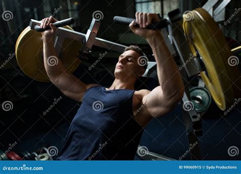 Man Doing Chest Press On Exercise Machine In Gym Stock Image Image Of