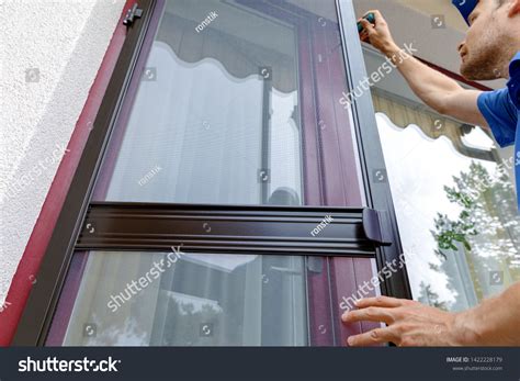 Man Installing Mosquito Net Wire Mesh Stock Photo 1422228179 Shutterstock