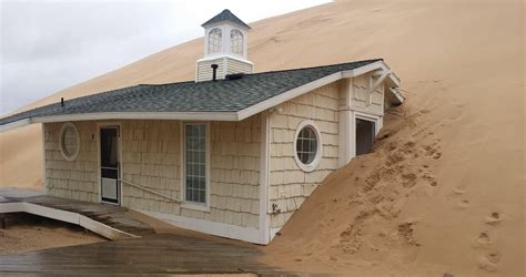 West Michigan Cottage Owner Fights Off Gargantuan Sand Dune