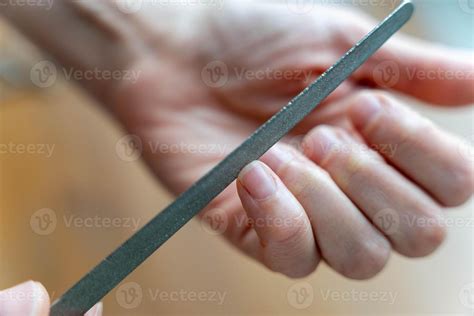 Manicurist Filing Woman S Nails With Precision Using A Nail File 47734287 Stock Photo At Vecteezy
