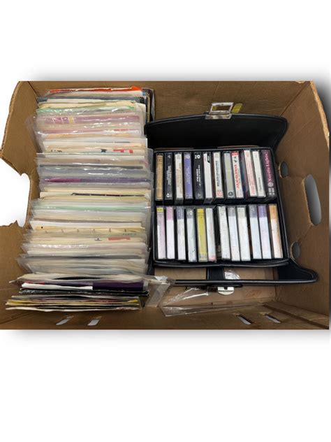 Assorted Vintage 45s And Cassette Tapes