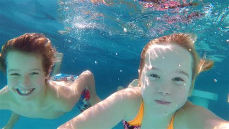 Gopro Underwater Shot Brother Sister Swimming Stock Footage Video 100