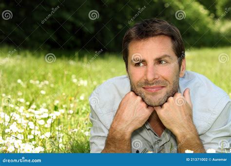 Portrait Of A Man On The Grass Stock Photo Image Of Sunny Thoughtful