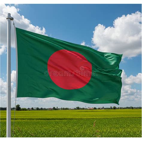 A Flag Of Bangladesh Waves Against A Rural Landscape The Flag Is Green
