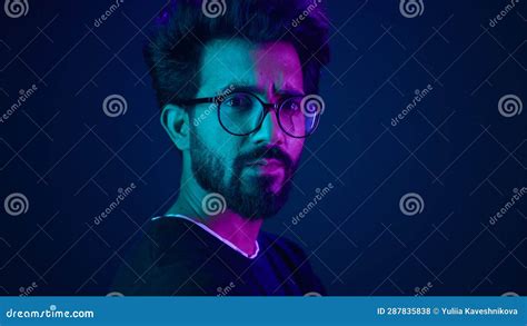 indian man guy profile turning head looking camera serious developer