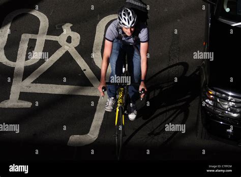 Looking Down On A Cyclist Cycling Passed A Cycle Waiting Zone At A Set