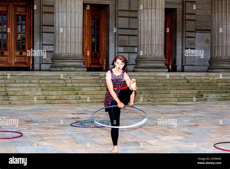 A Young Woman Hula Hooping At Dundees City Square In Front Of The