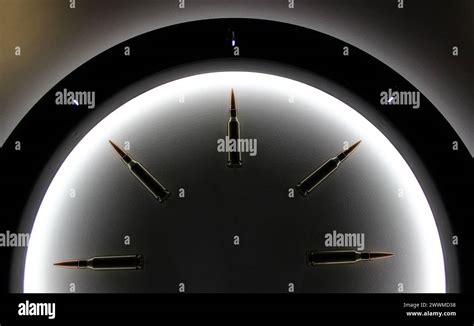 Top Part Of Classic Clock Dial Made Of Bullets Inside A Circle Of Light