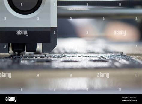 3d Printer Close Up A Working 3d Printer In Process Of Printing Object