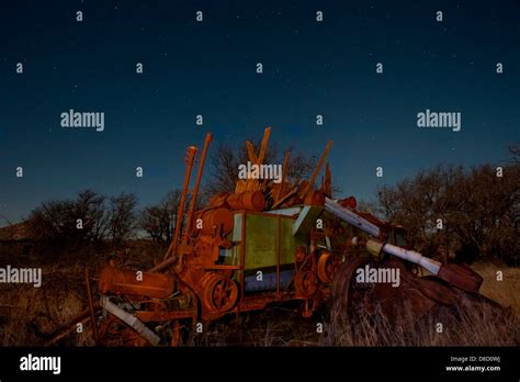 Abandoned Old Farm Equipment Thrasher In A Field Out In West Texas