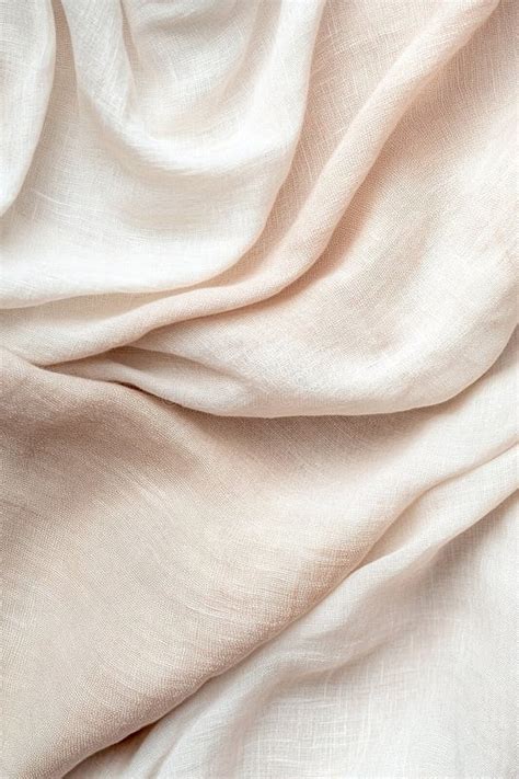 Layers Of Soft Linen And Woolen Textiles Create A Serene Backdrop With