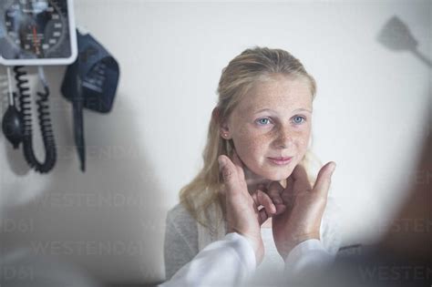 Doctor Checking Girl S Lymph Nodes Stock Photo