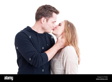 Happy Couple Standing And Kissing Wearing Autumn Clothes Isolated On