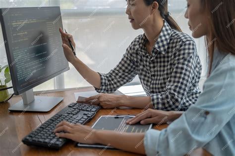 Premium Photo Programmer Working In A Software Development And Coding Technologies Website