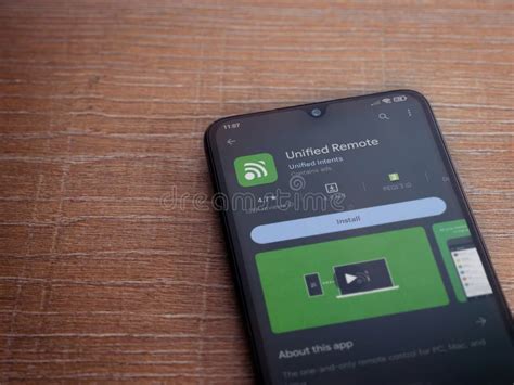 Unified Remote App Play Store Page On Smartphone On Wooden Background Editorial Photo Image Of